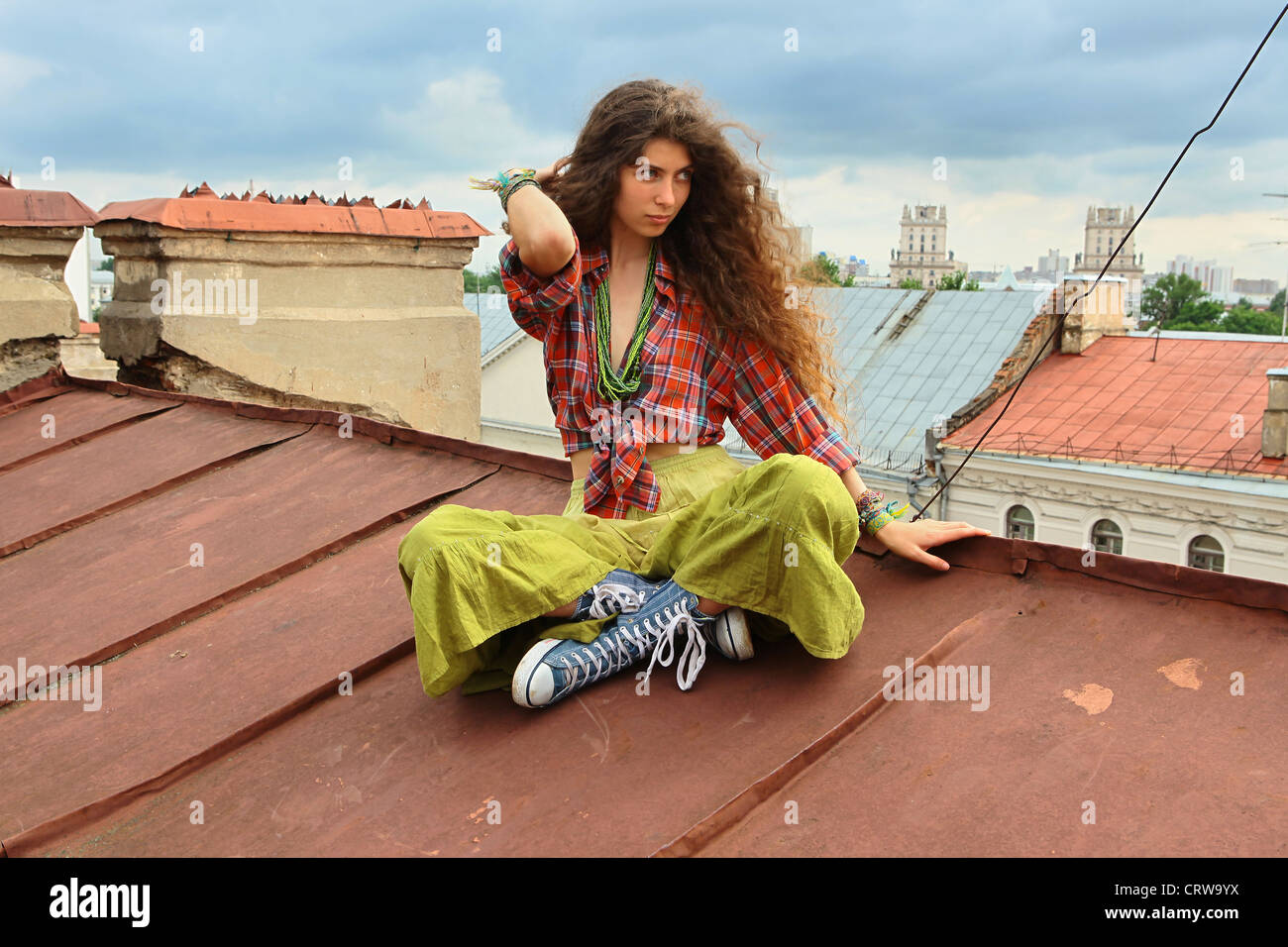 Girl Sitting On Roof House High Resolution Stock Photography and Images ...