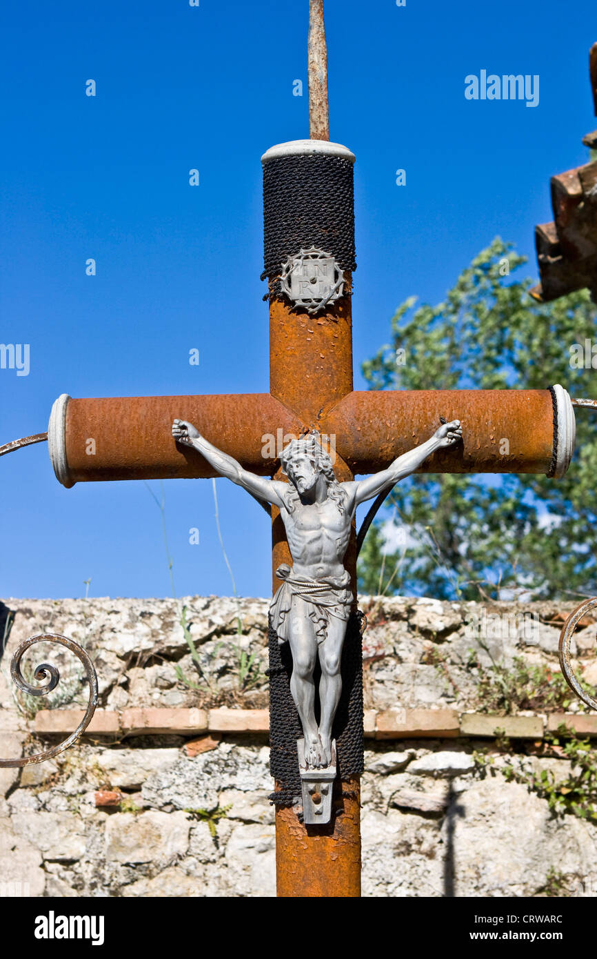 Statue of Christ on a rusty cross in a graveyard Stock Photo - Alamy