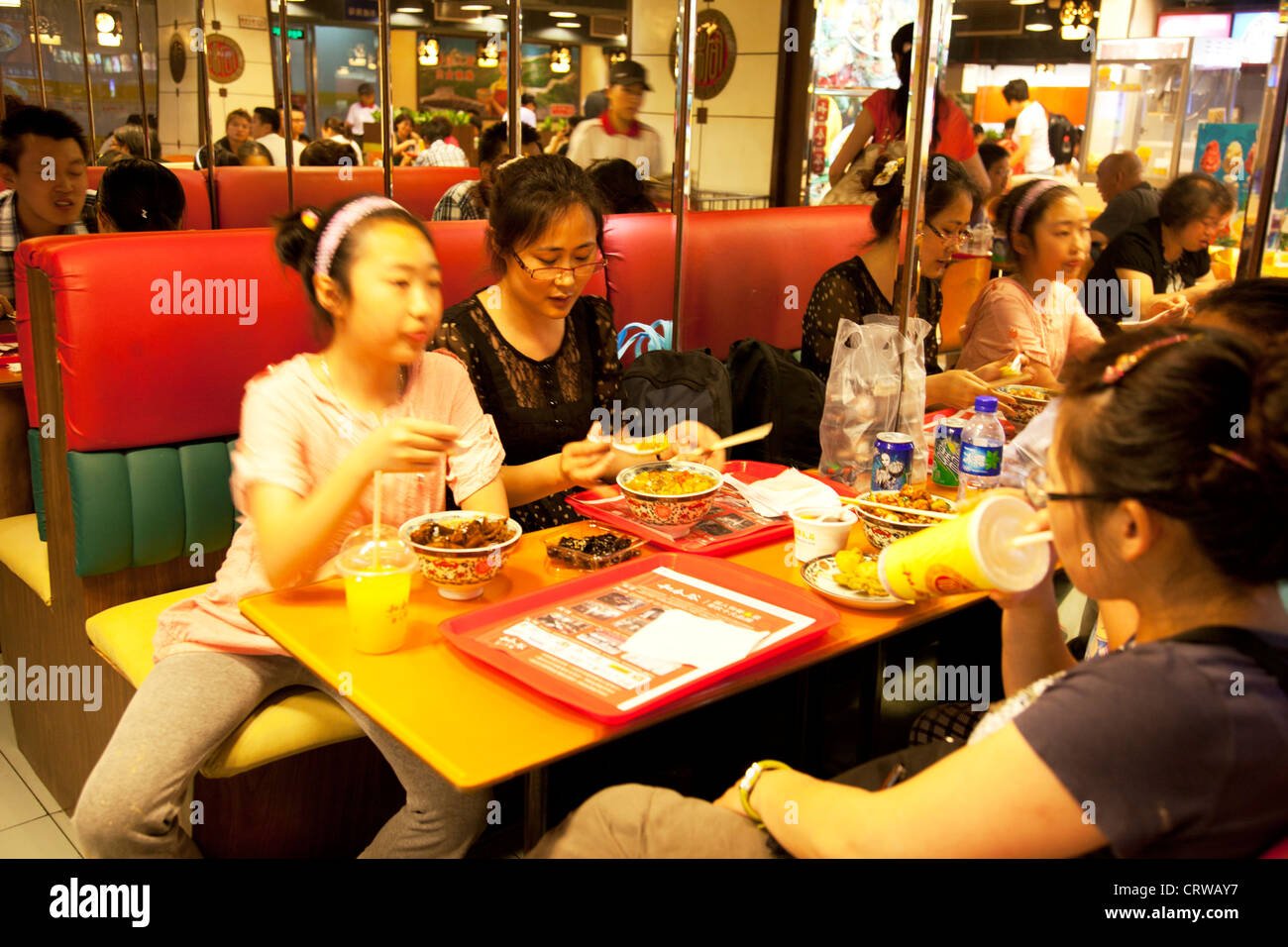 People eating in a western fast food restaurant inside Joy City ...
