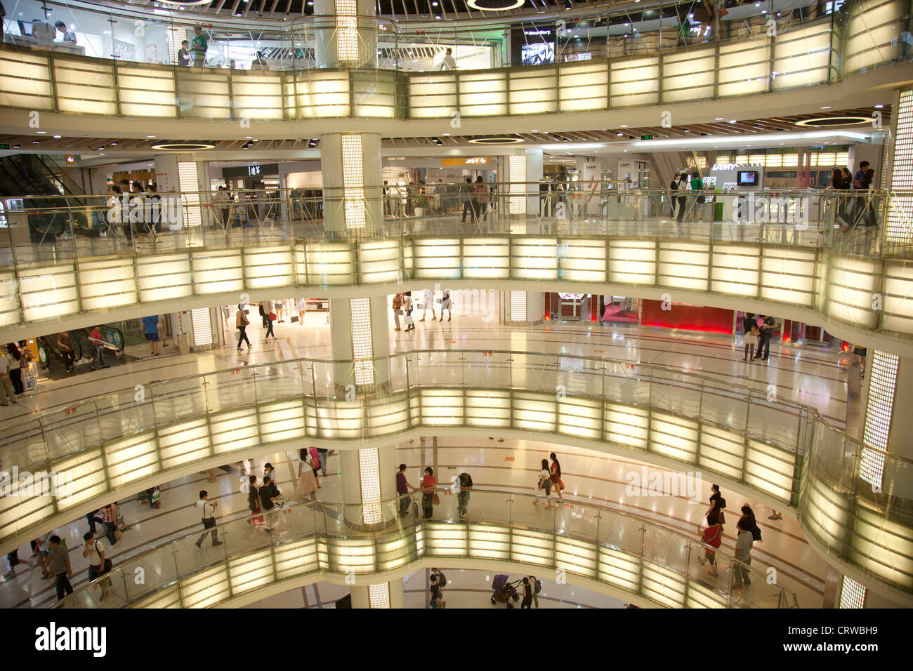 Interior of floor levels, atrium and shoppers at Joy City shopping mall ...