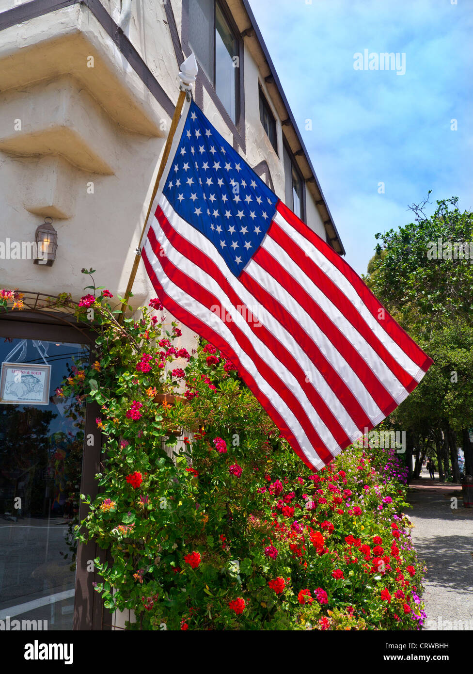 American flag outside store hi-res stock photography and images - Alamy