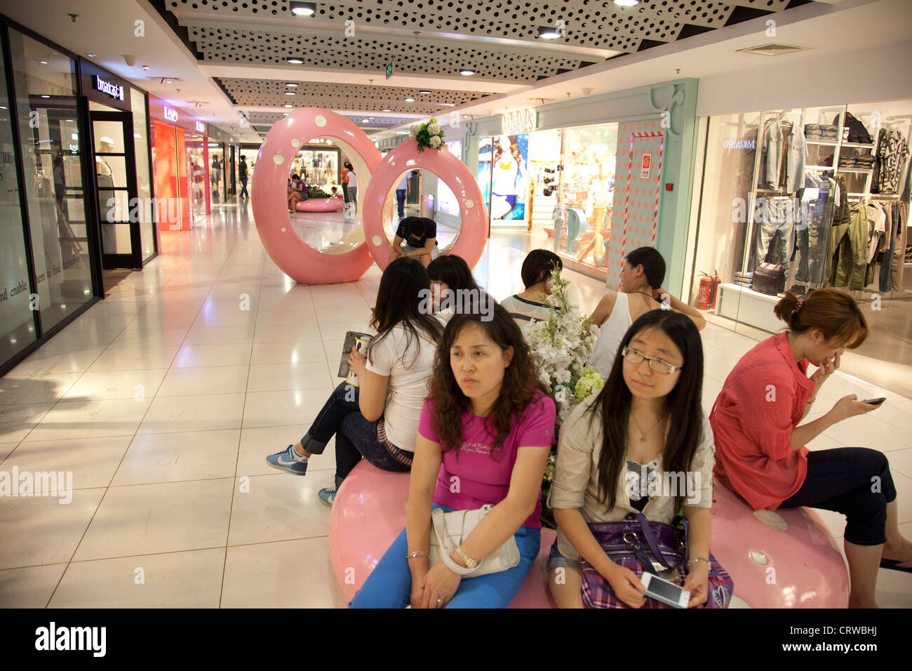 Shoppers at Joy City shopping mall. Xidan is one of the main commercial ...