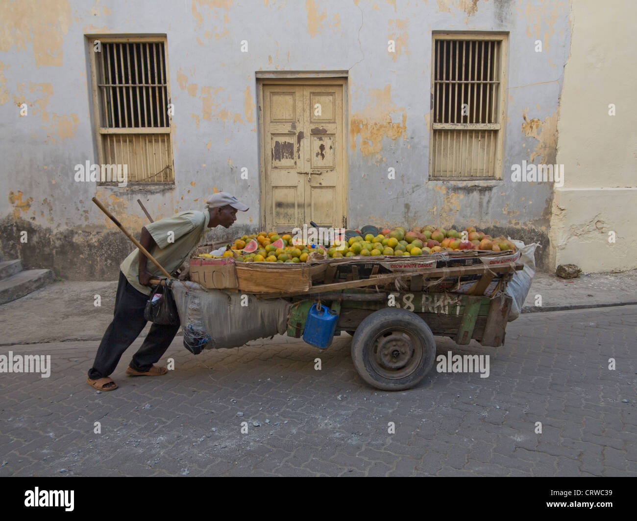 Man pushing fruit cart in the old town in Mombasa, Kenya Stock Photo ...
