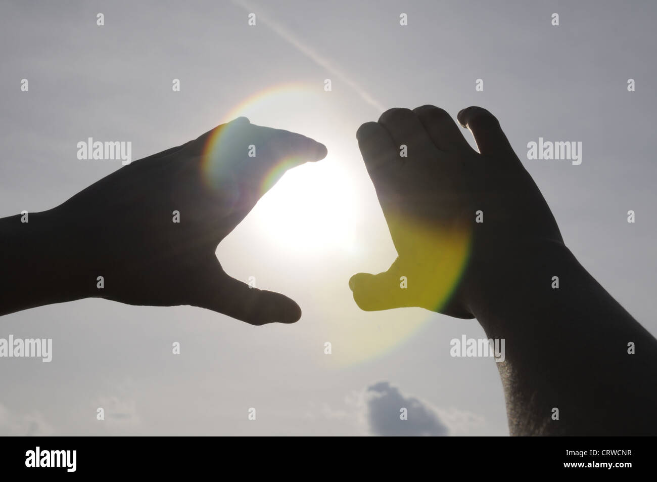 two hands holding the sun Stock Photo - Alamy