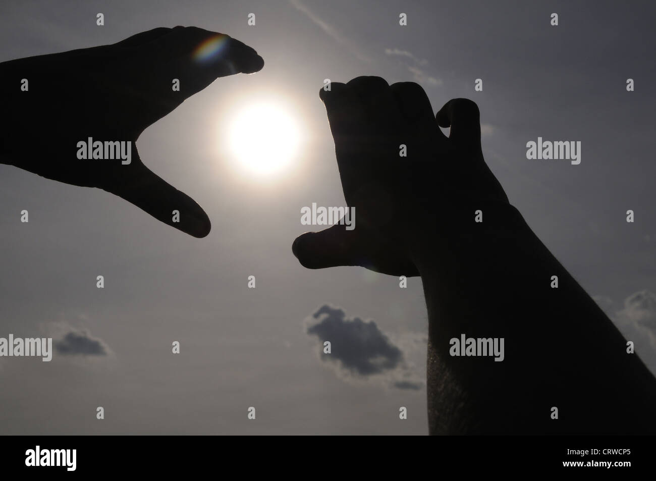 two hands holding the sun Stock Photo - Alamy