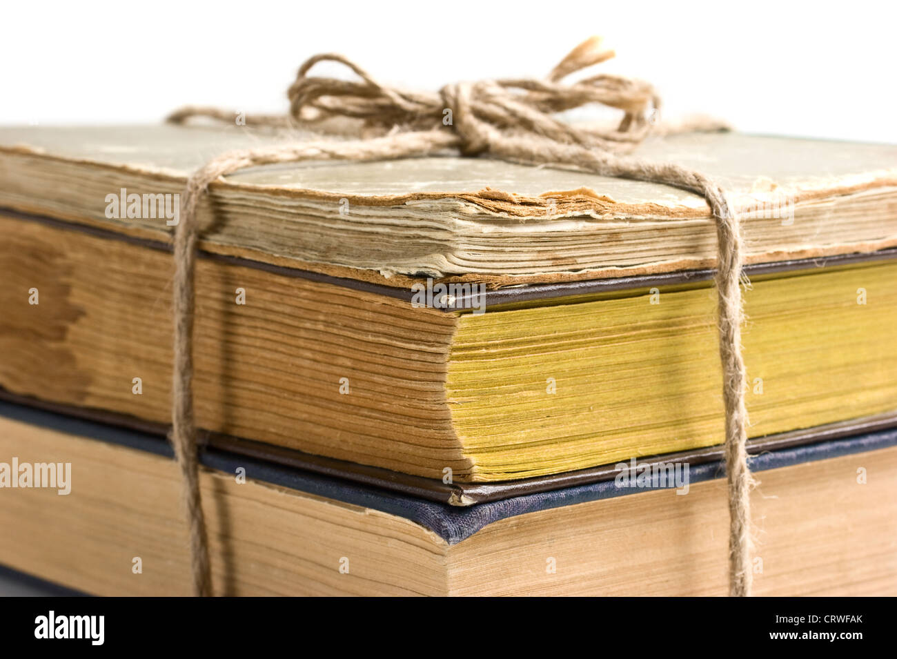 stack of old books tied with rope Stock Photo - Alamy
