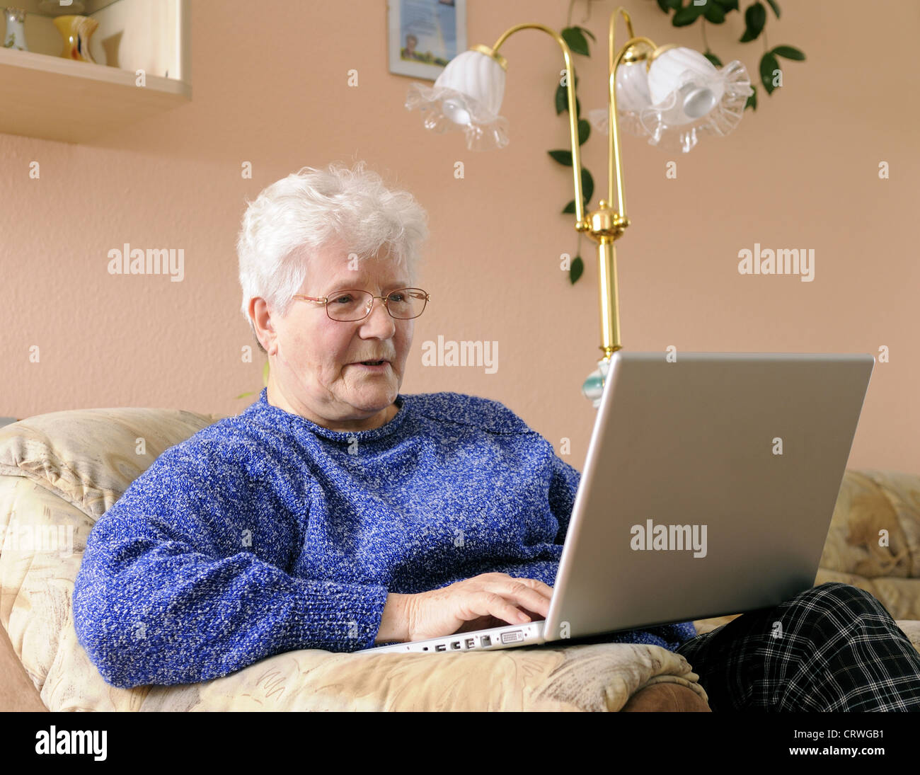 older woman working on laptop Stock Photo - Alamy