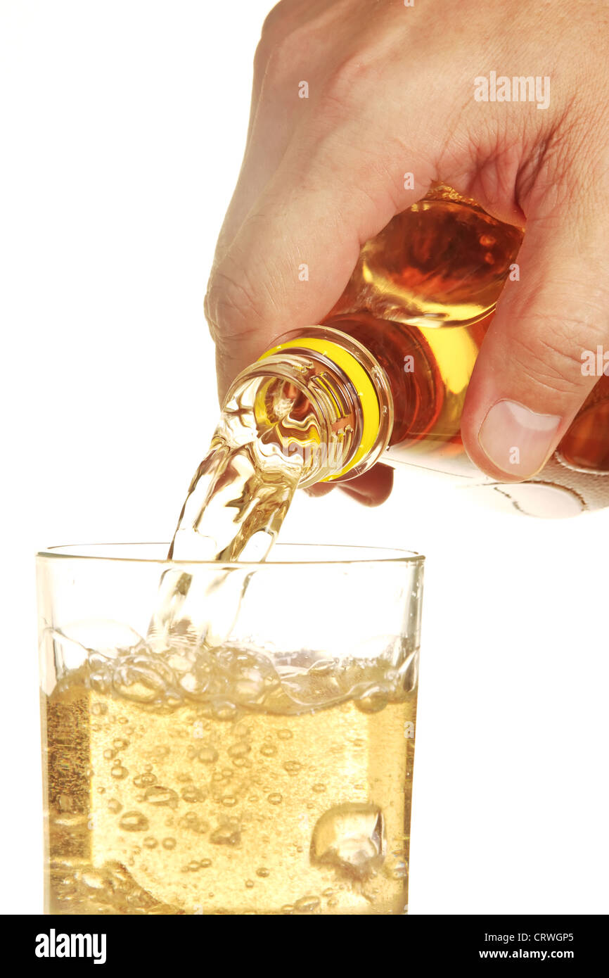 man's hand pours a drink into a glass Stock Photo - Alamy