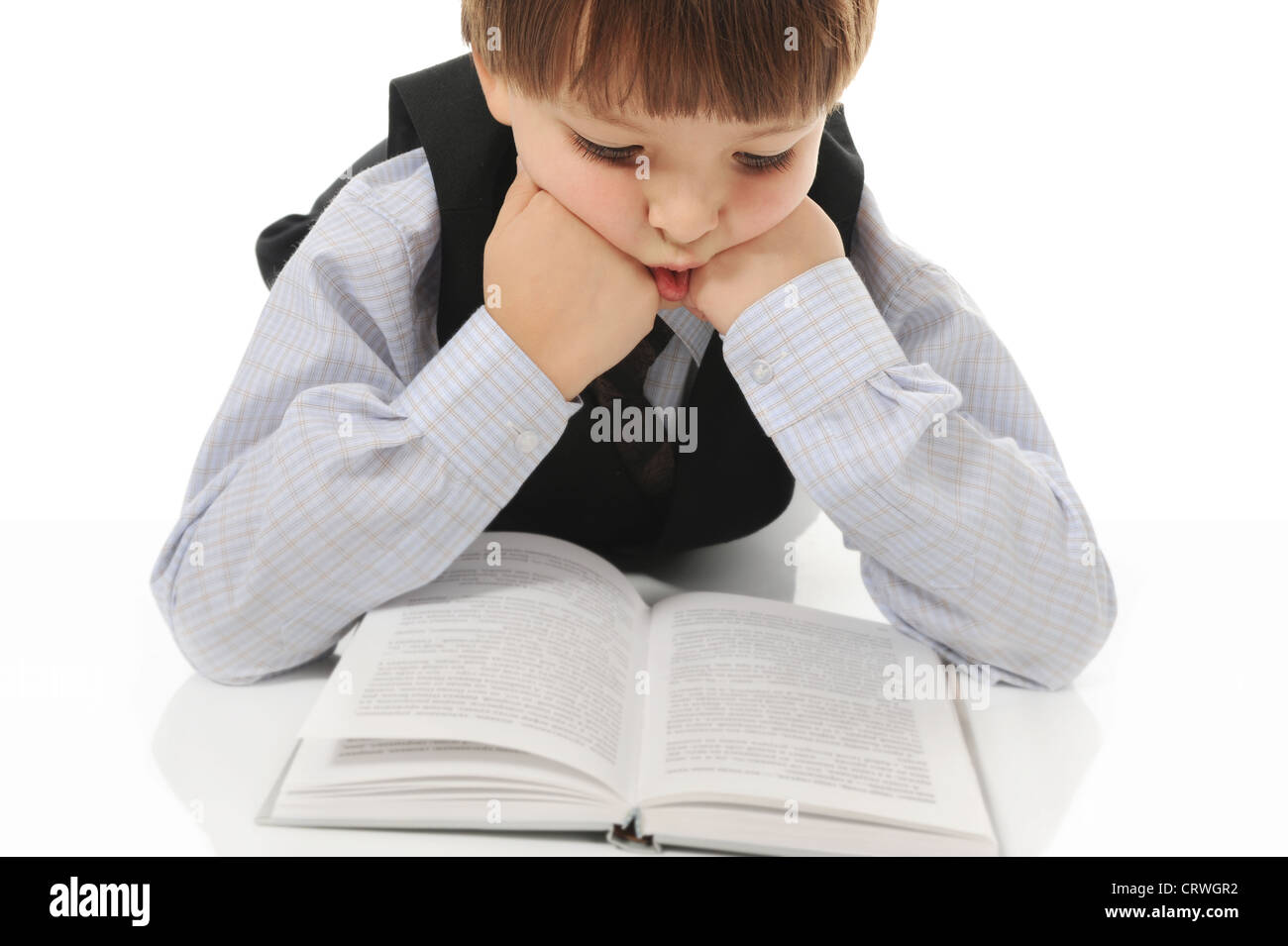 Boy reading a book Stock Photo - Alamy