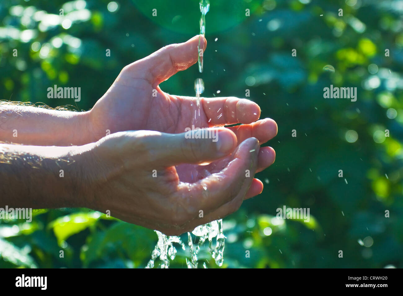 Hand washing in the summer of clean water Stock Photo - Alamy