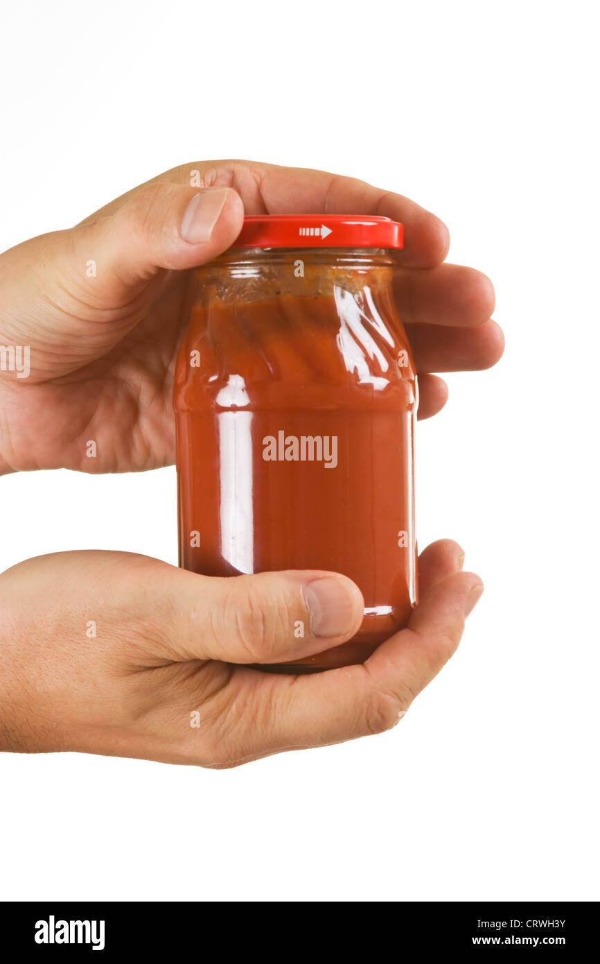 jar tomato paste in hands Stock Photo - Alamy