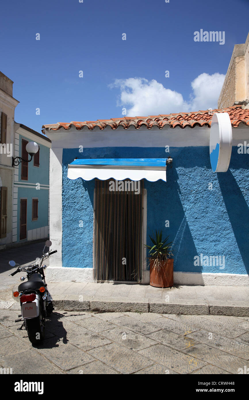 blue house on a street Stock Photo - Alamy