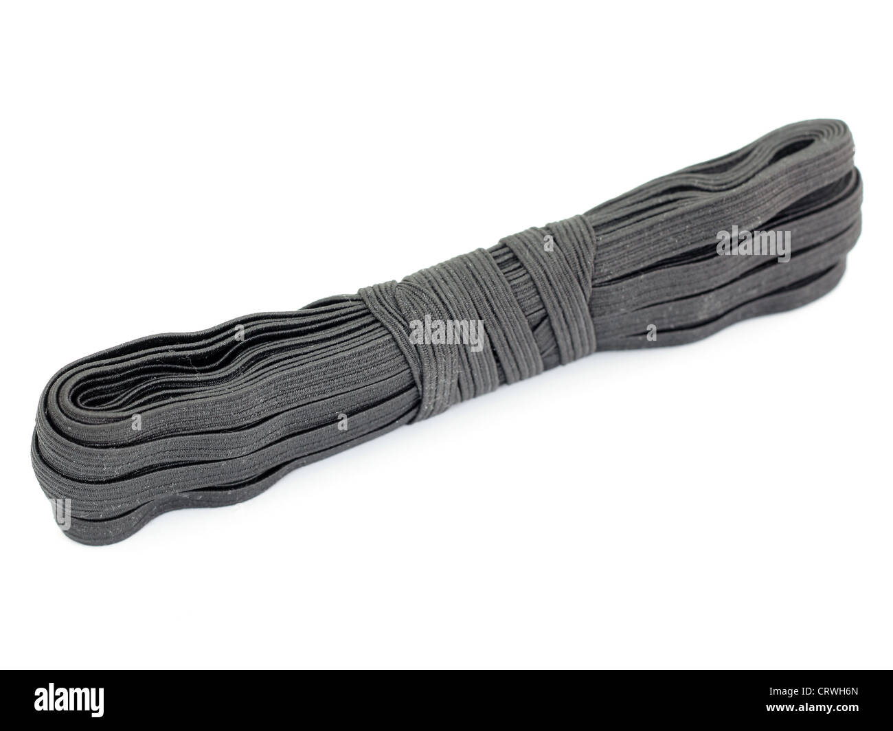 Sewing black rubber on a reel. Isolated on white background Stock Photo ...