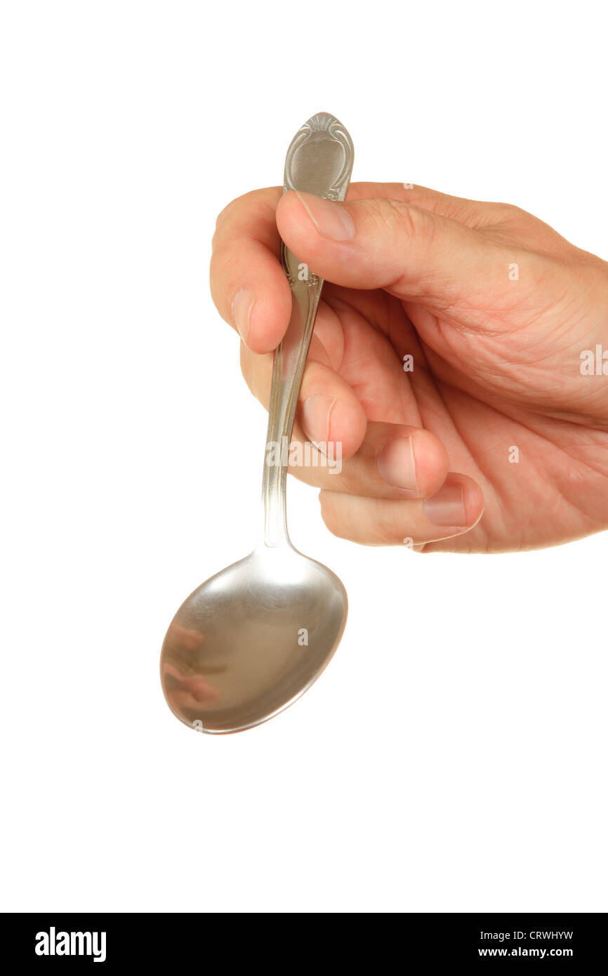 Hand holding spoon cook utensil hi-res stock photography and images - Alamy