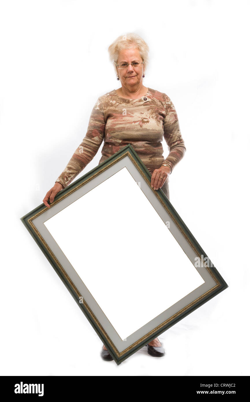 Middle aged woman holding blank picture frame Stock Photo - Alamy