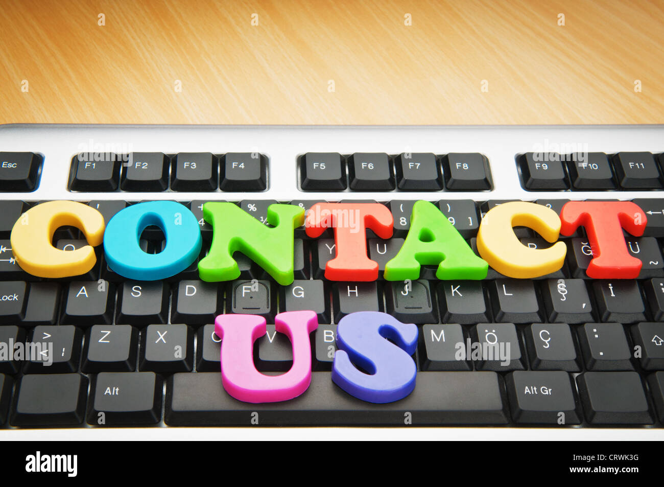 Contact us concept with letters on keyboard Stock Photo - Alamy