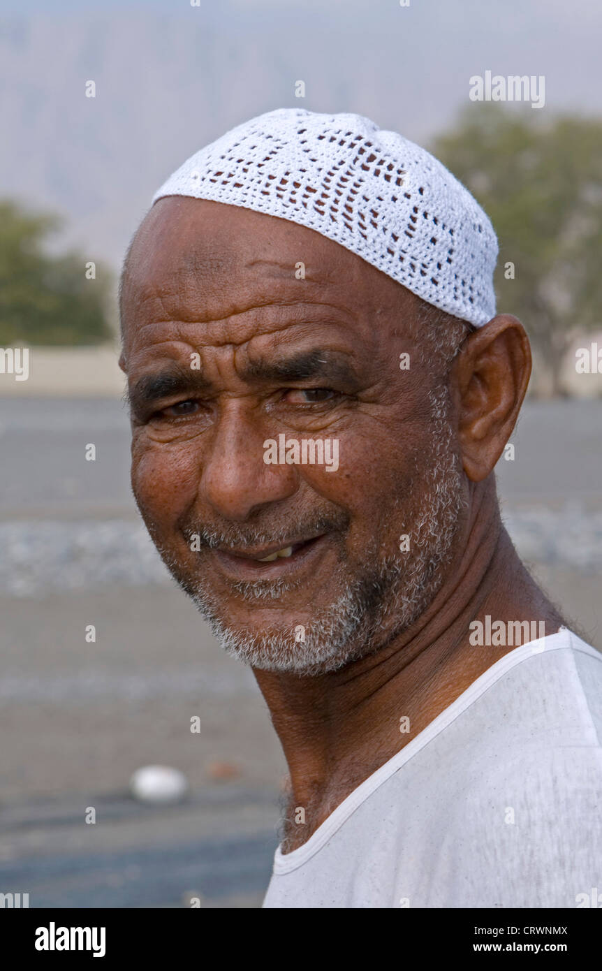 Arab fisherman in Islamic cap, Limah Bay, Limah, Musandam (east coast ...