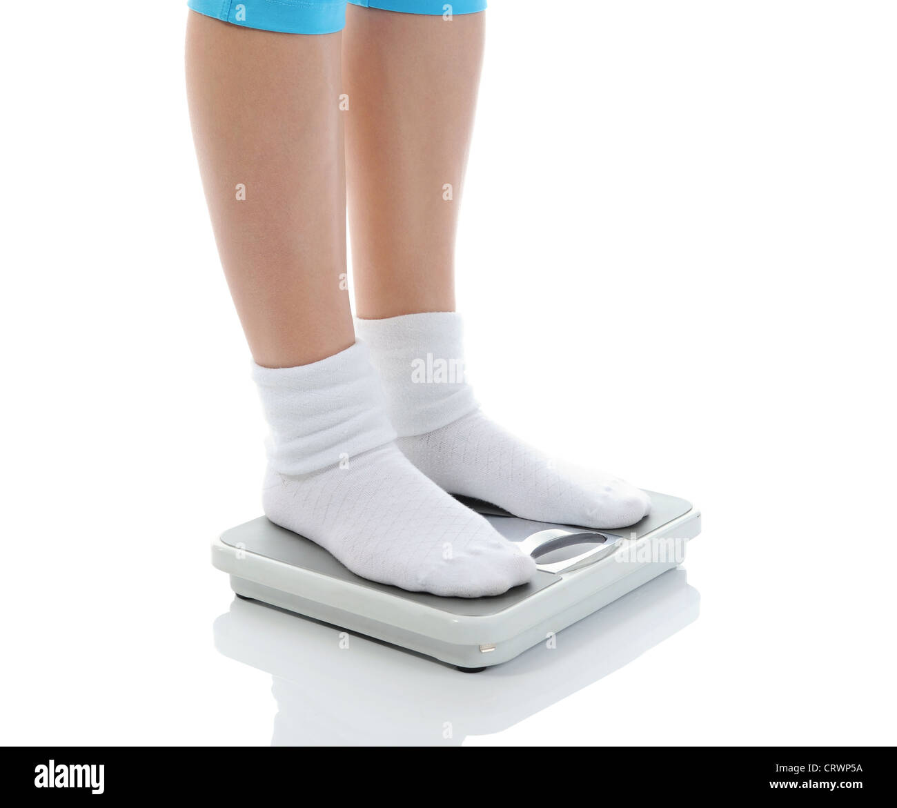 young athletic girl standing on the scales Stock Photo - Alamy