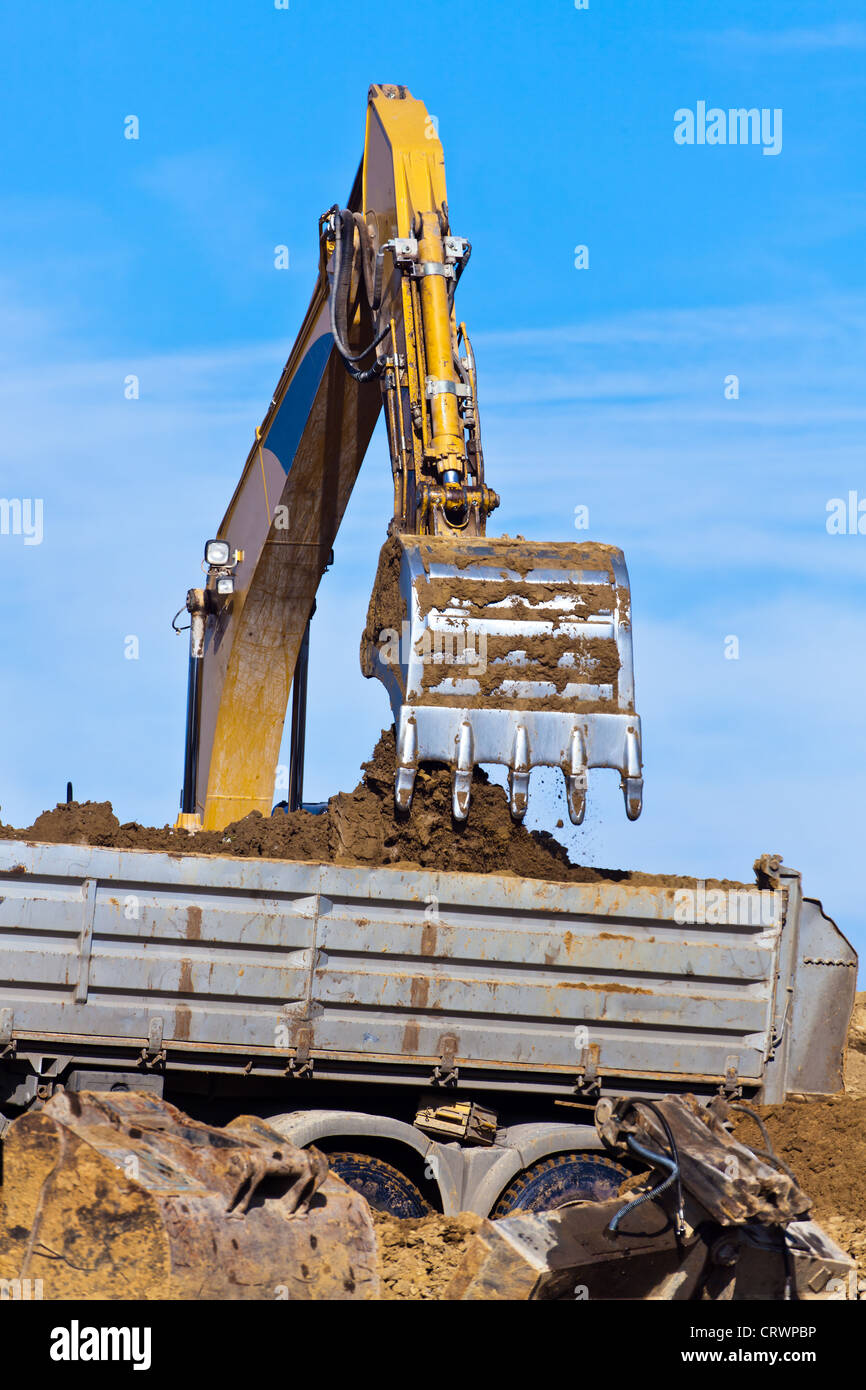 Excavator at construction work on site Stock Photo - Alamy