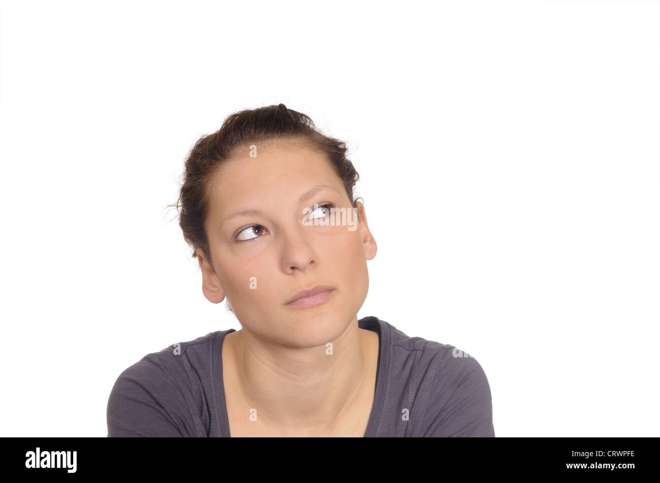 beautiful brunette woman looks pensively Stock Photo - Alamy