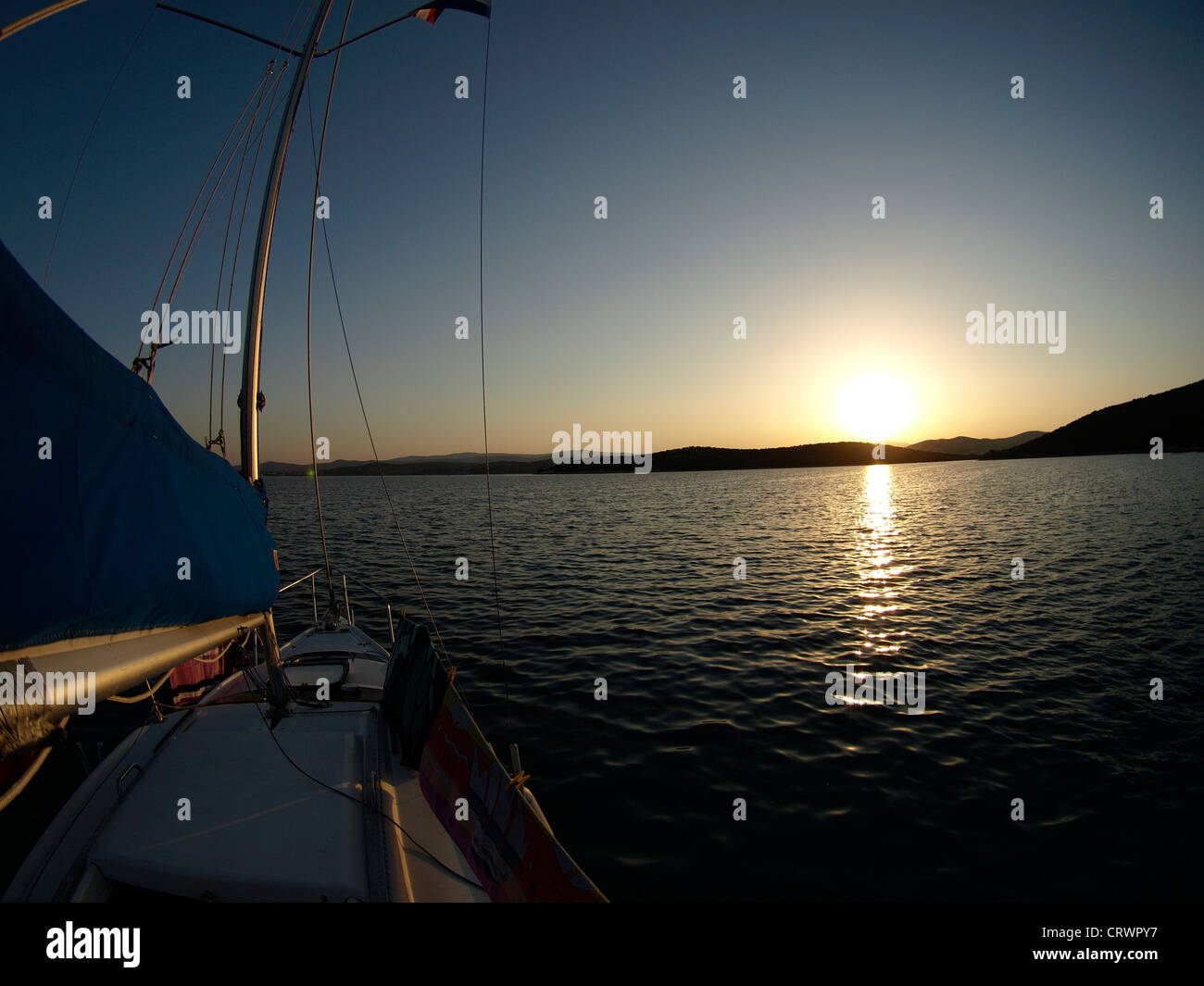 Sailboat in front of setting sun hi-res stock photography and images ...
