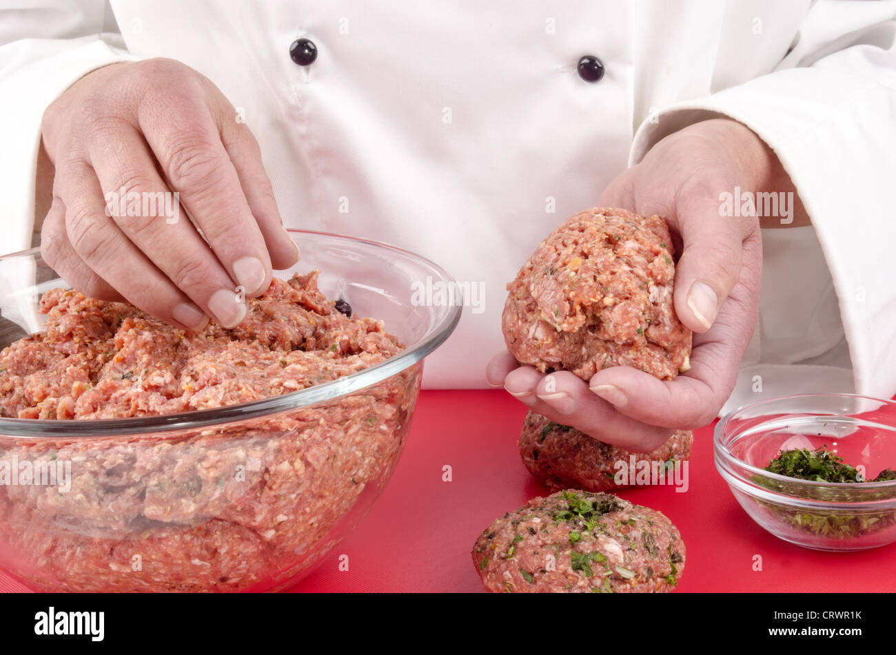 minced meat and chopped herbs to make meat balls Stock Photo - Alamy