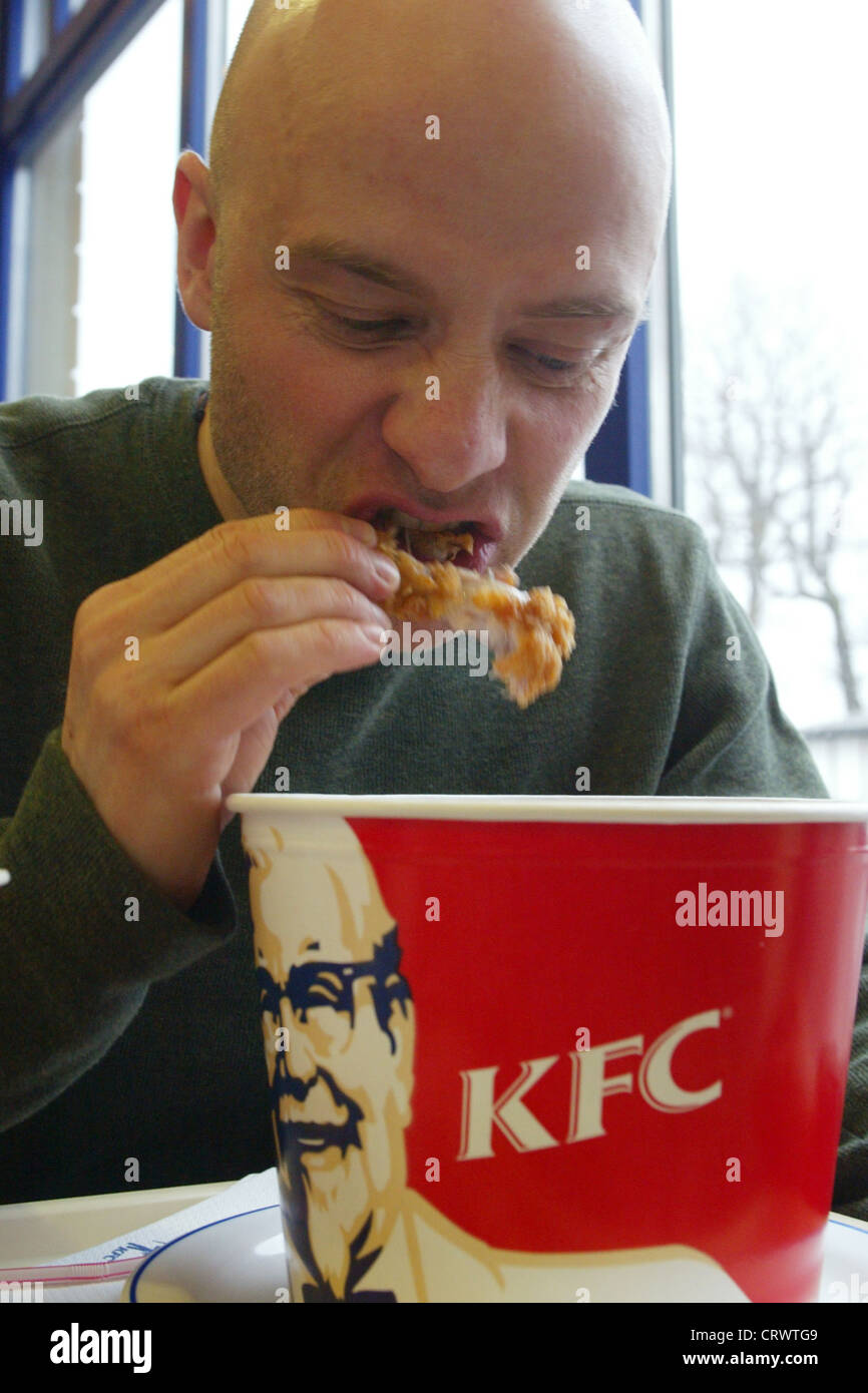 A man eating fast food Stock Photo - Alamy