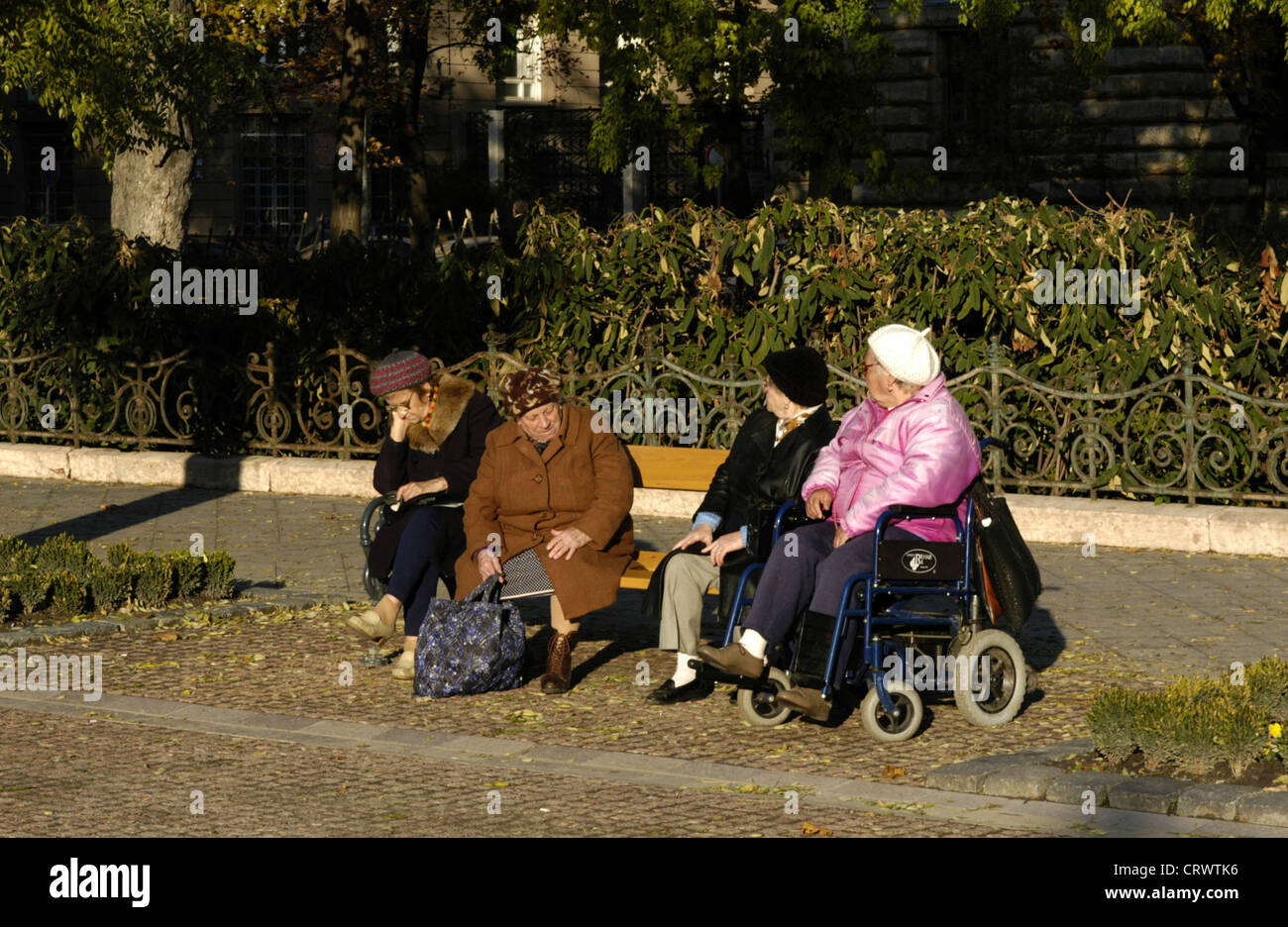 Seniors sitting on a park bench in Budapest Stock Photo - Alamy