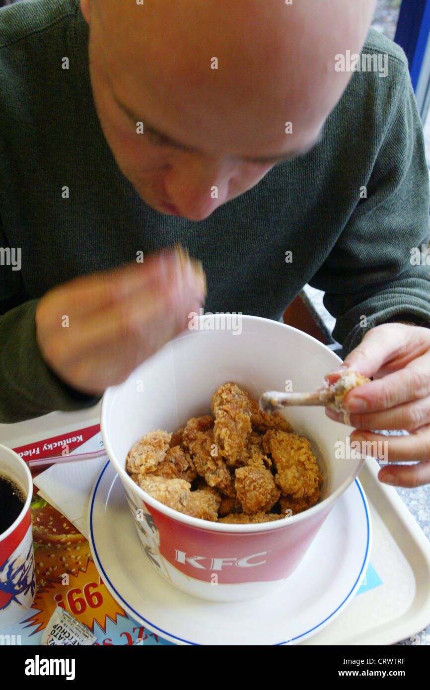 A man eating fast food Stock Photo - Alamy