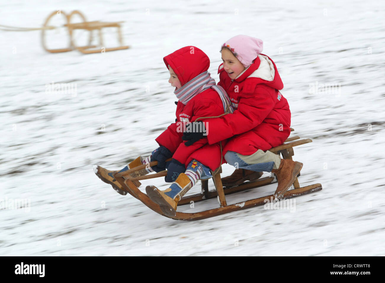 Children while sledding Stock Photo - Alamy