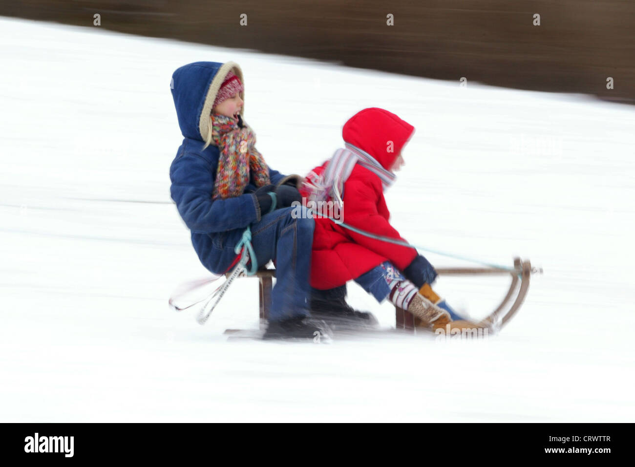 Children while sledding Stock Photo - Alamy