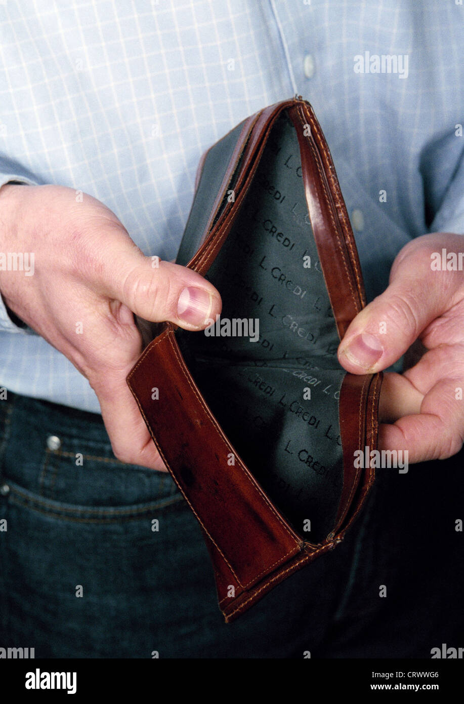 A man holds an empty open wallet Stock Photo - Alamy