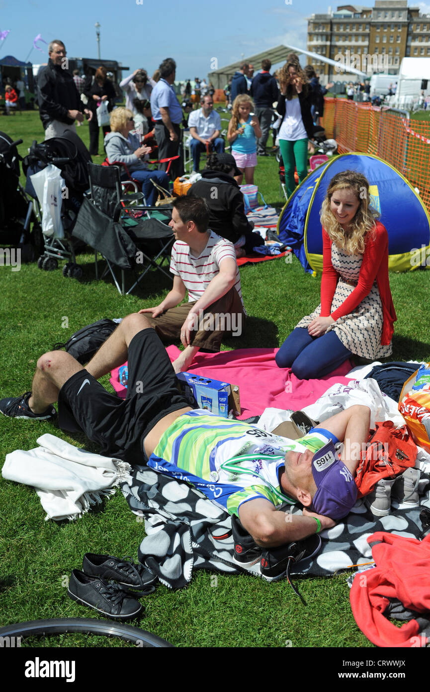 Exhausted cyclist takes a rest after the Capital to Coast Cycle ride ...