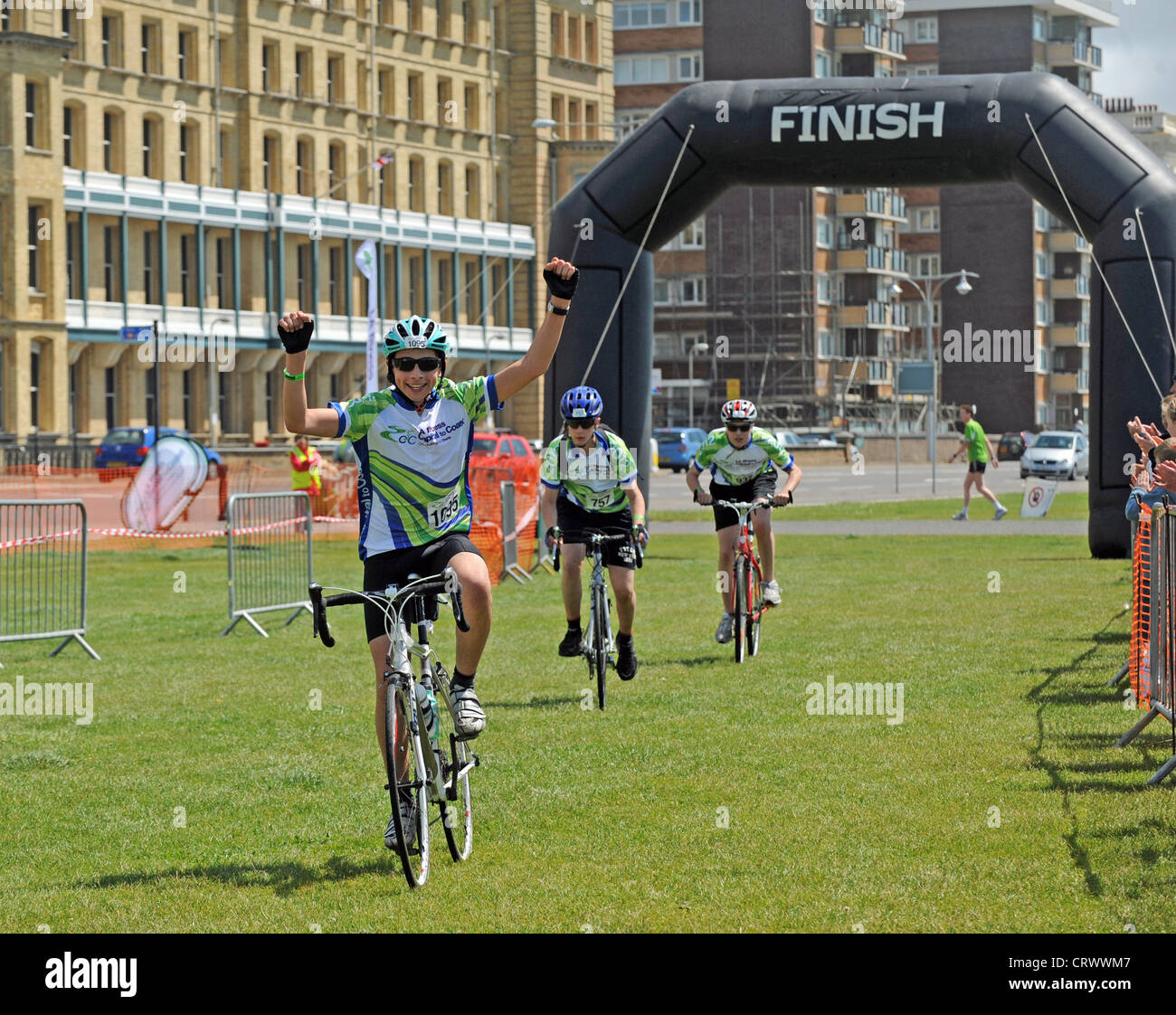 Cyclists cross the finishing line in Hove after completing the Capital ...