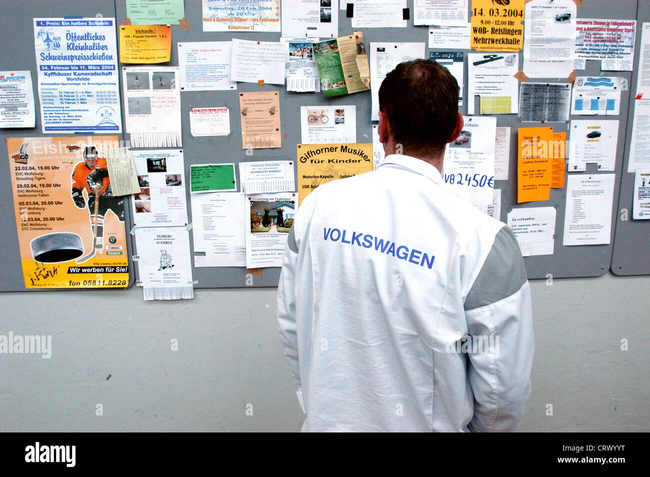 Employees on the bulletin board Stock Photo - Alamy