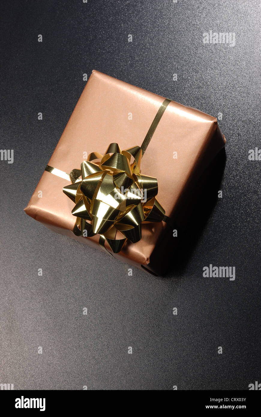 A single gift box on dark background Stock Photo - Alamy