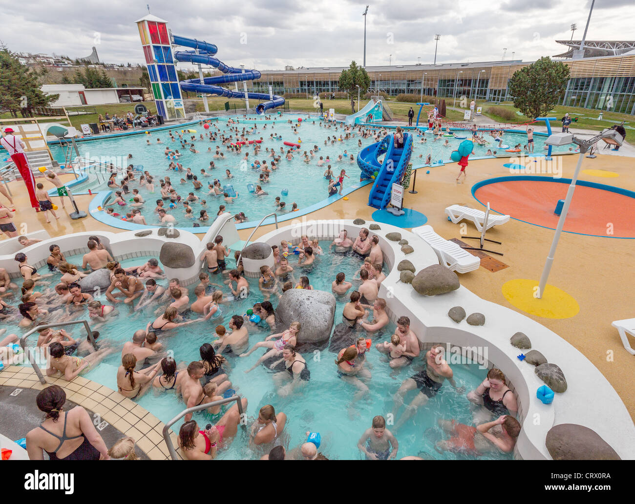 Crowed swimming pool, Reykjavik, Iceland. Swimming pools in Iceland are ...