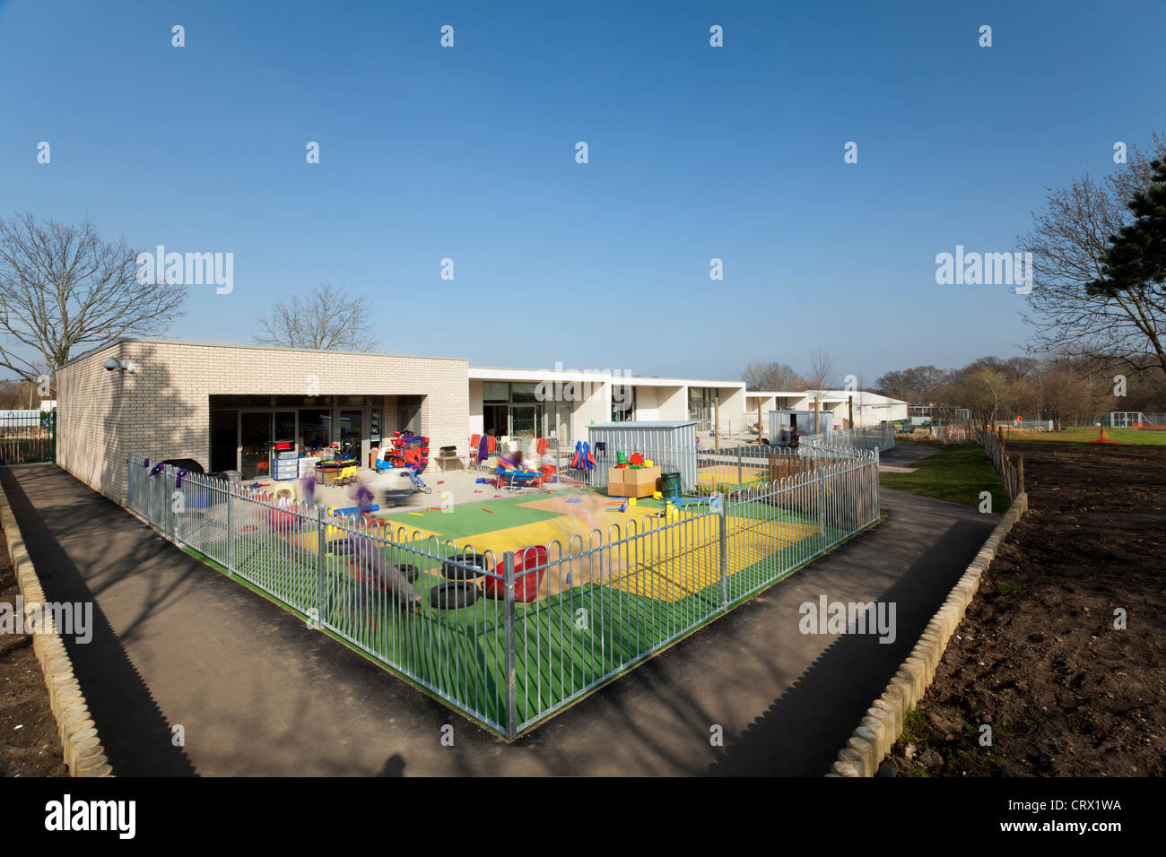 Children playing school playground uk hi-res stock photography and ...