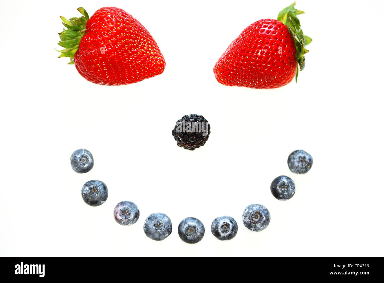 a smiley face in the form of various berries healthy eating Stock Photo ...