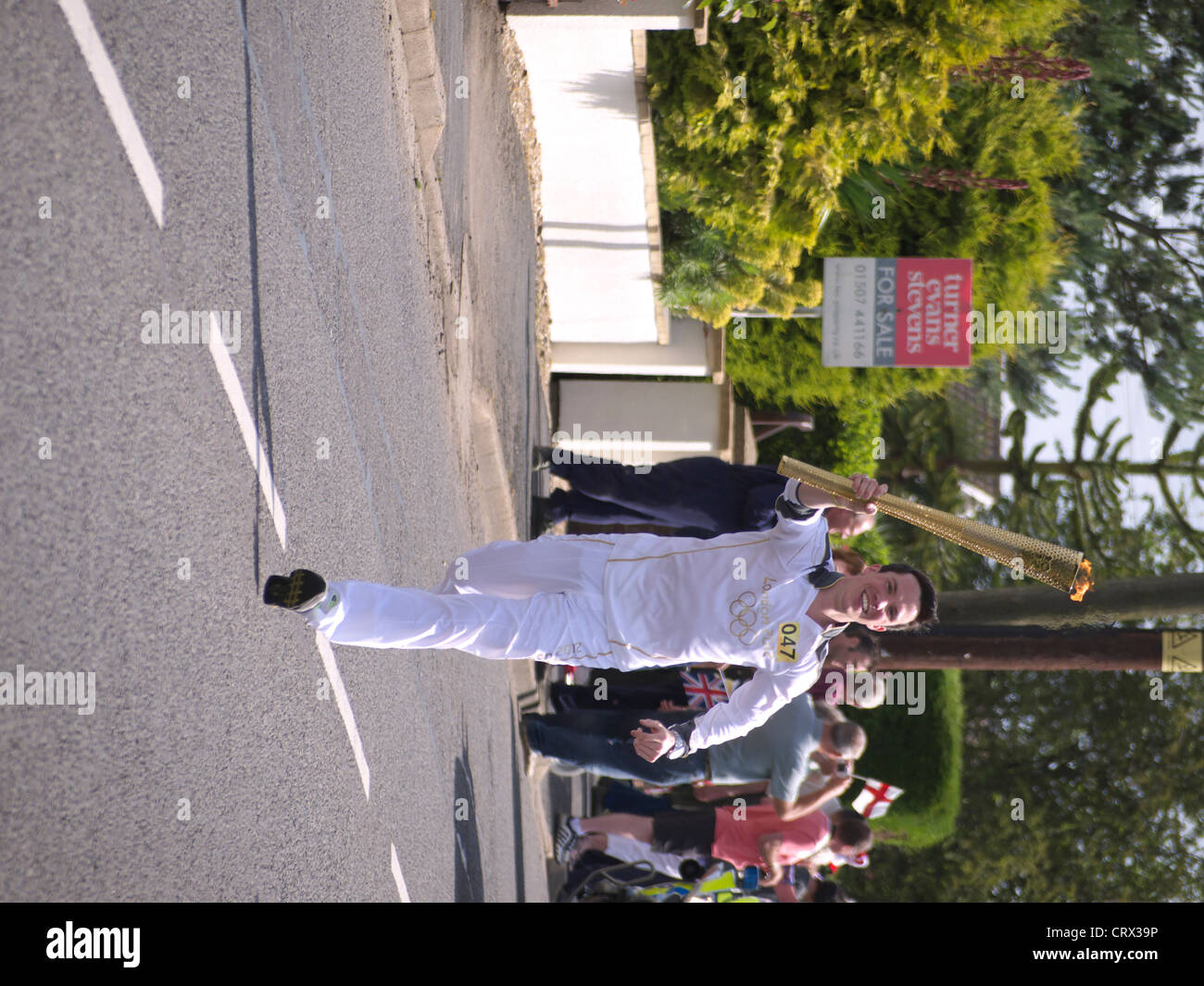 On his way Torch bearer running through Trusthorpe during the torch ...