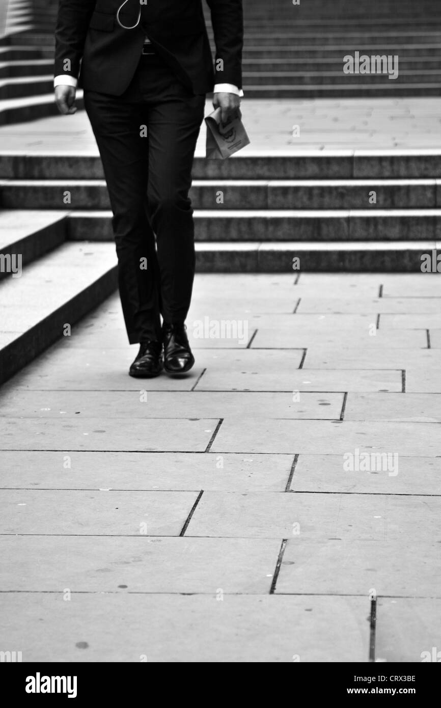 Monochrome Image of Businessman Walking Stock Photo - Alamy
