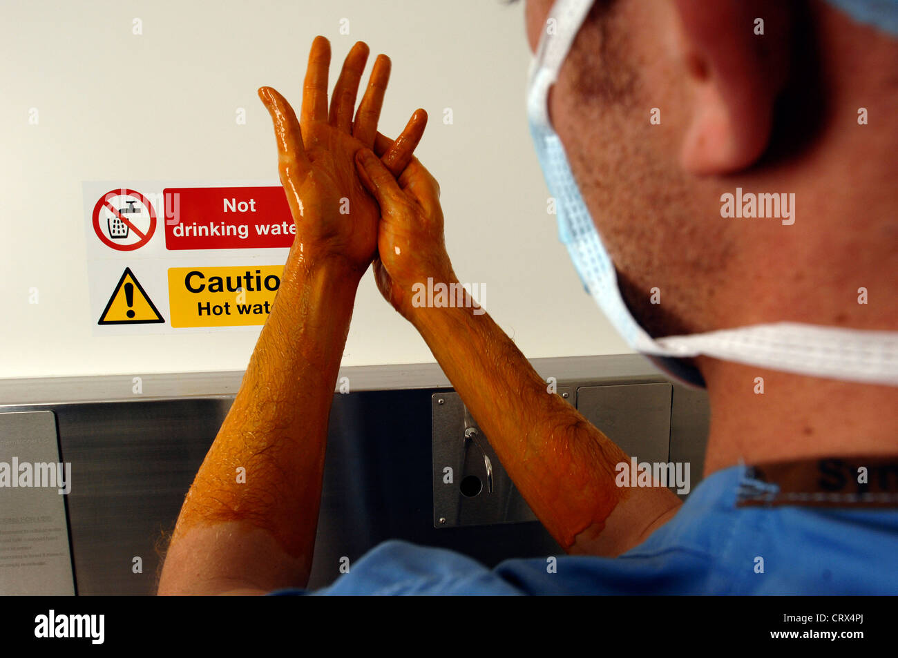 A surgeon scrubs up before an operation Stock Photo - Alamy