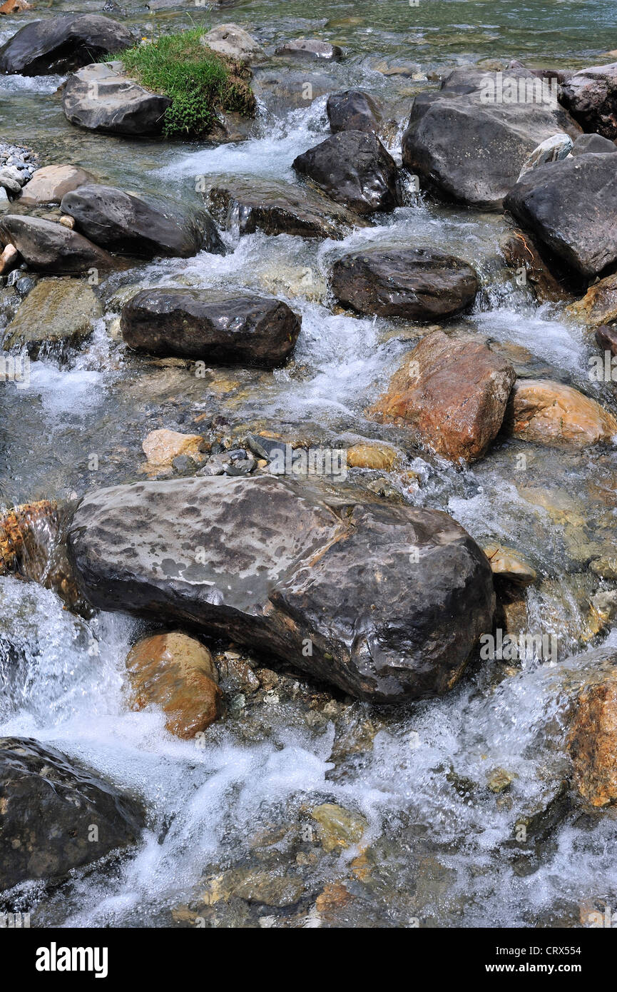Boulders in fast flowing mountain stream, Pyrenees, France Stock Photo ...