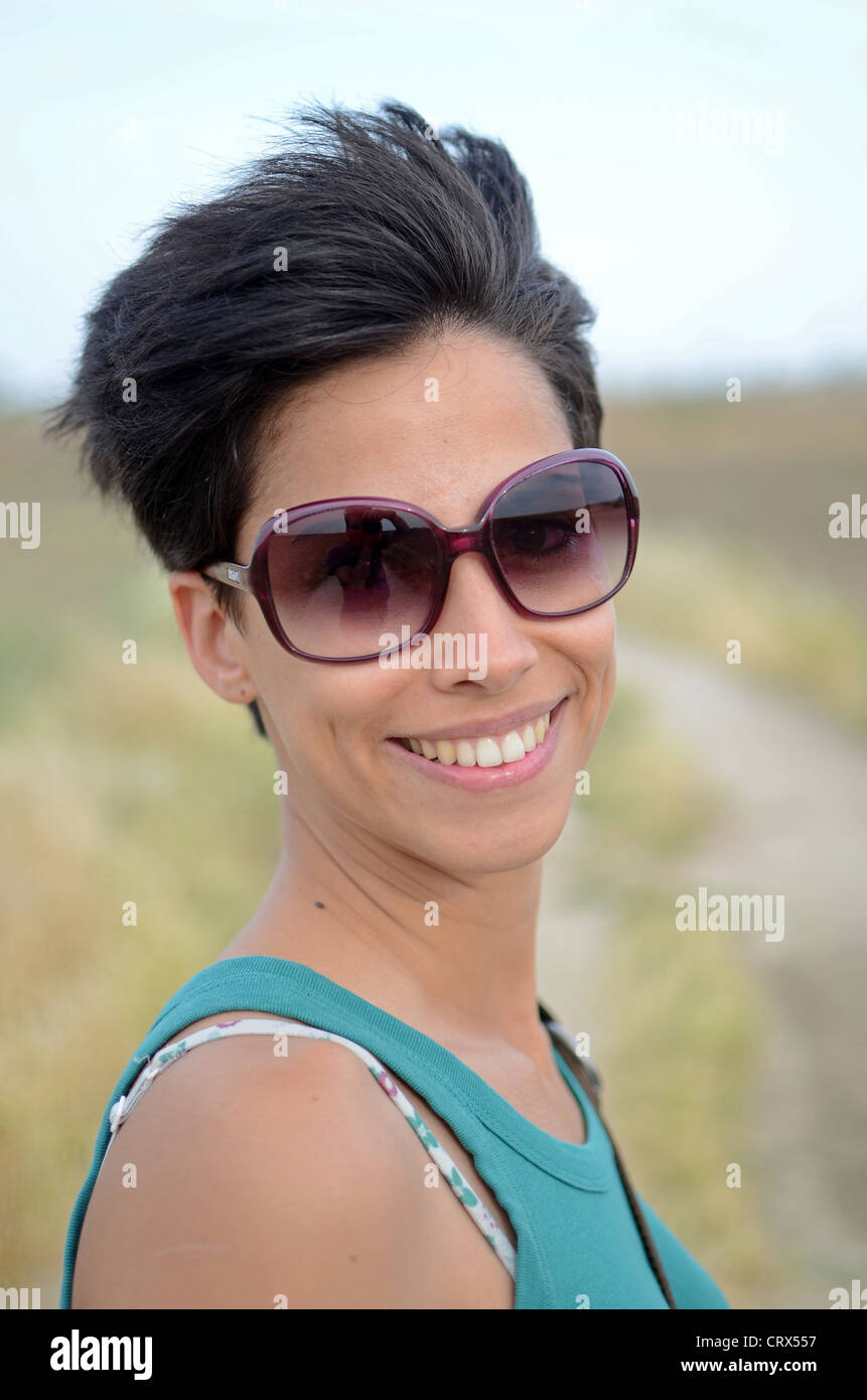 Attractive short haired girl in nature Stock Photo - Alamy