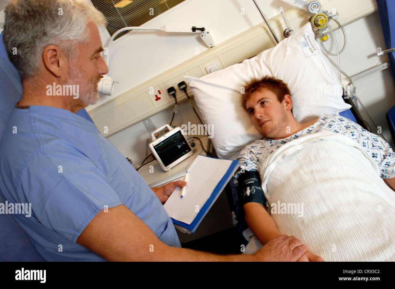 Patient in bed after operation nurse hi-res stock photography and ...
