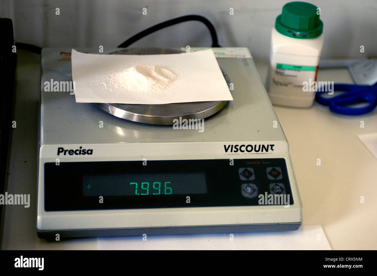 An ingredient for a skin ointment being weighed in a hospital pharmacy ...