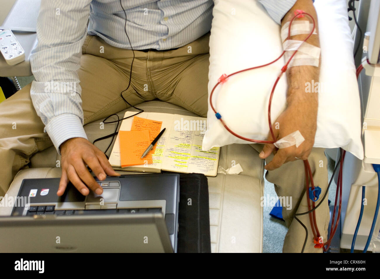 A patient on kidney dialysis using his laptop computer Stock Photo - Alamy