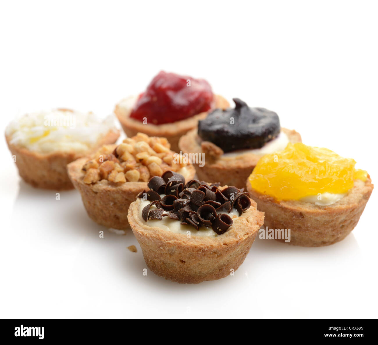 Assortment Of Small Round Cheesecakes On White Background Stock Photo ...
