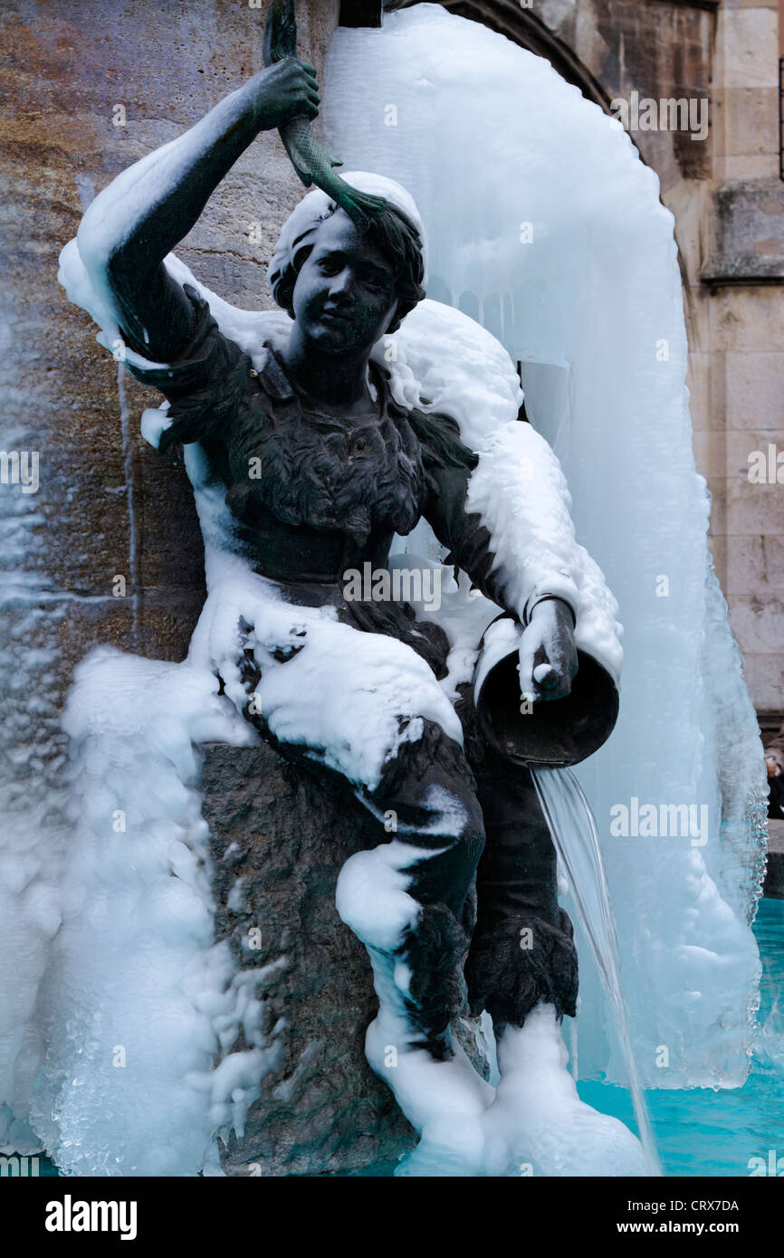 Frozen Figure at the Fish Fountain Stock Photo - Alamy