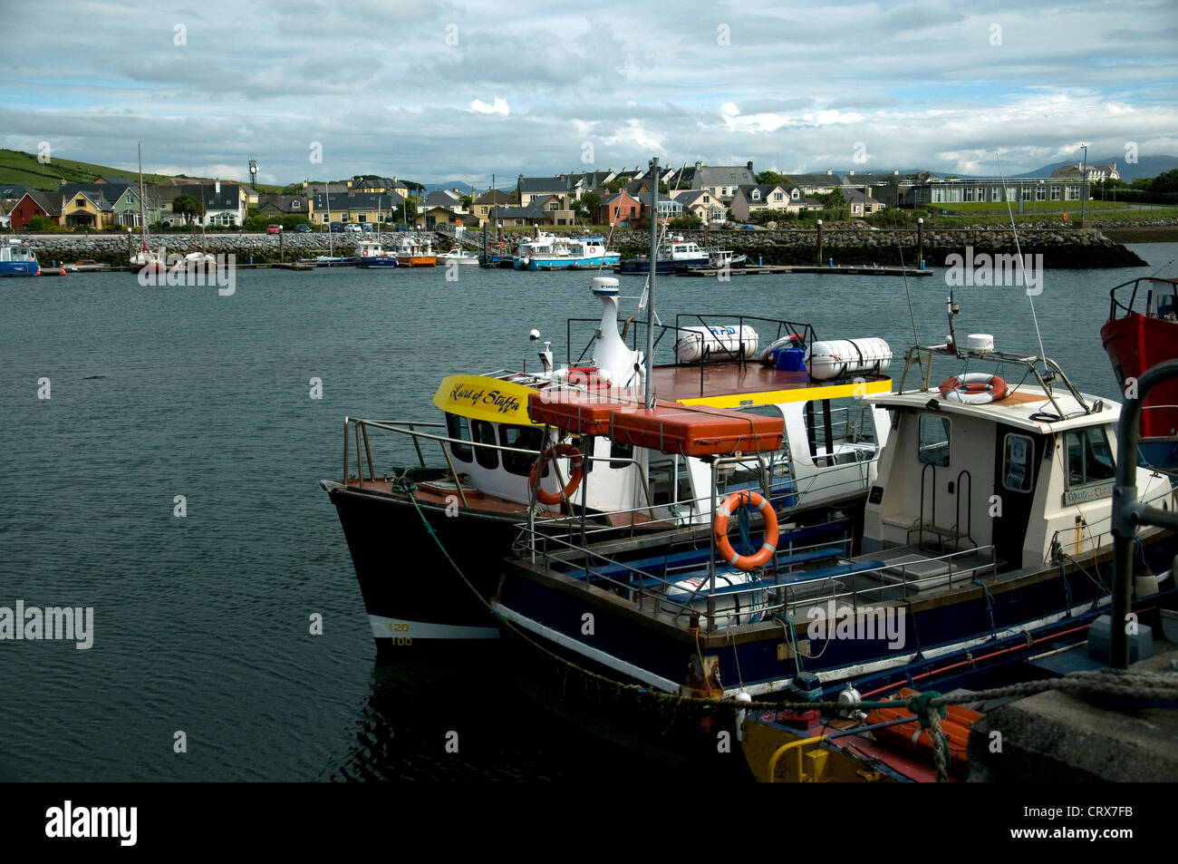 Dingle harbour with boats; the town is a popular resort in Co.Kerry ...